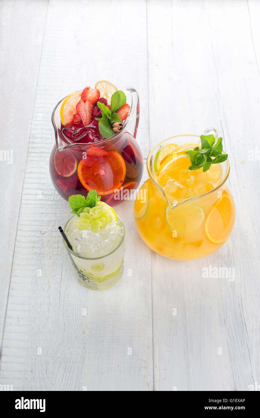 Three summer lemonade on a white wooden background Stock Photo - Alamy