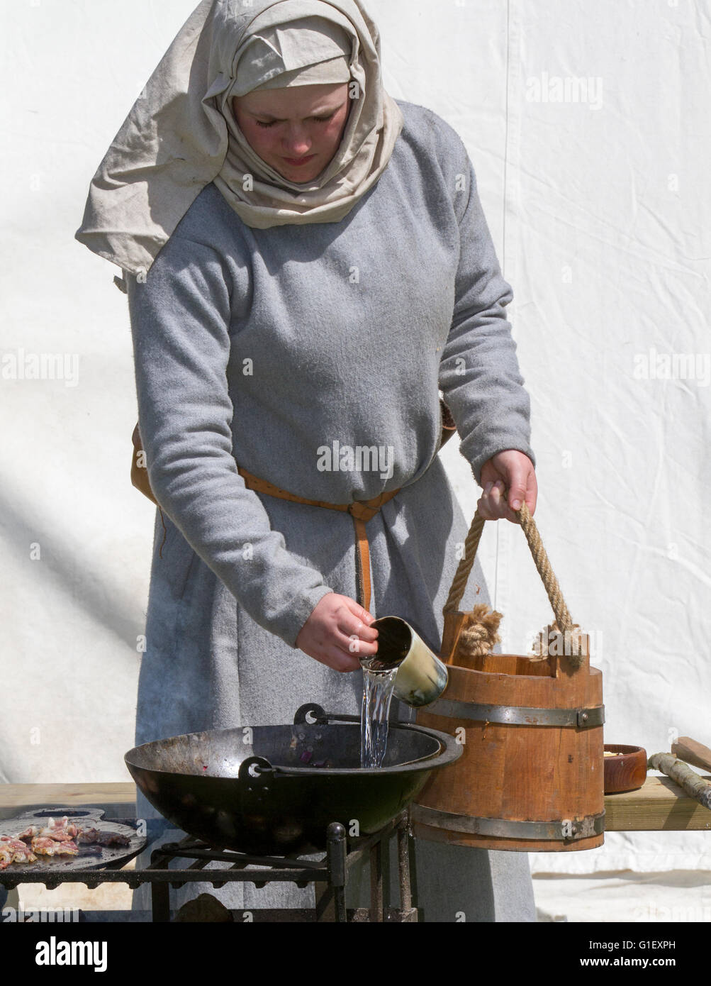 Cooking over a camp fire. The re-enactment group Historia Normannis ...