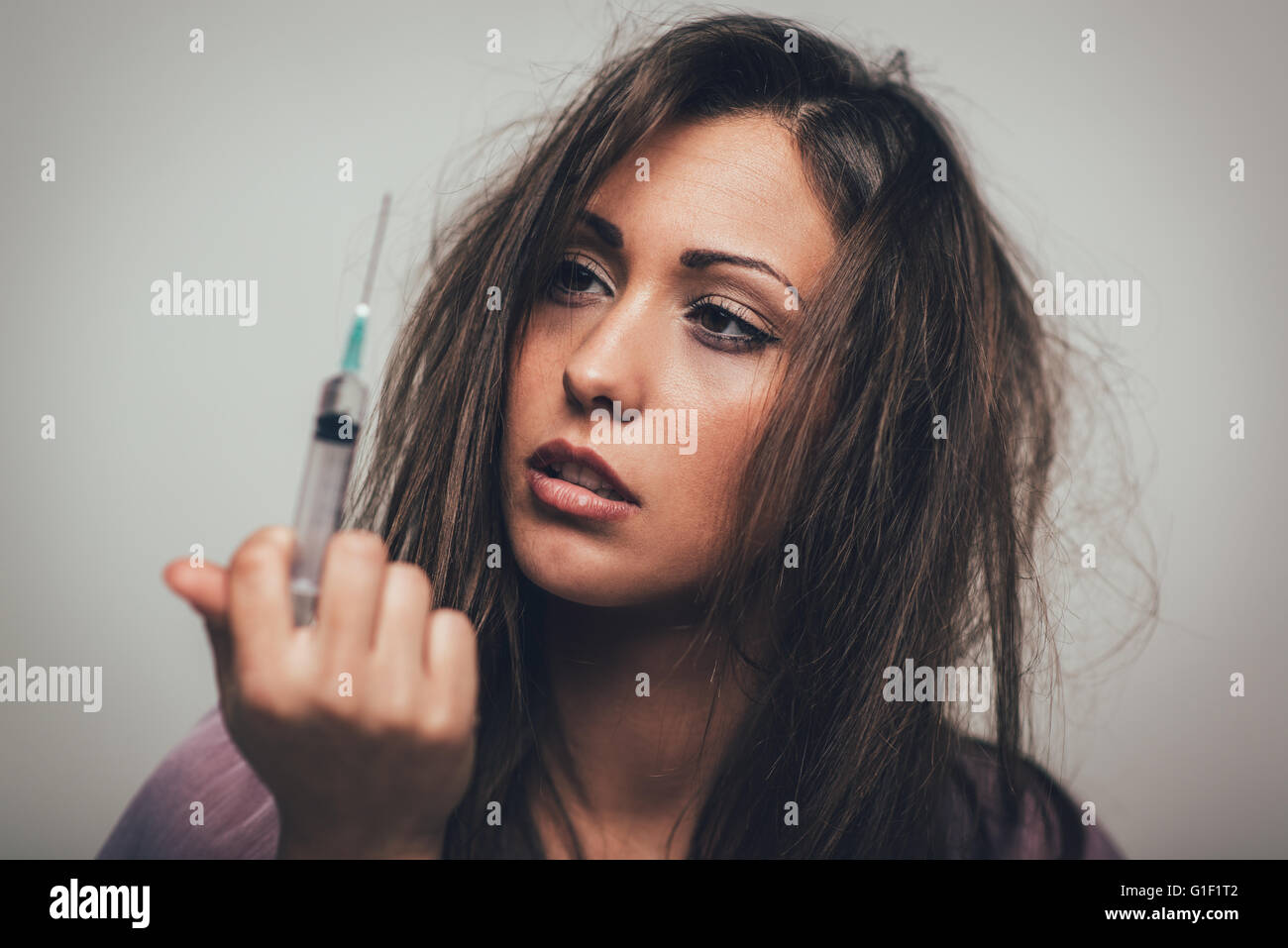 Young woman drug addiction syringe hi-res stock photography and images ...
