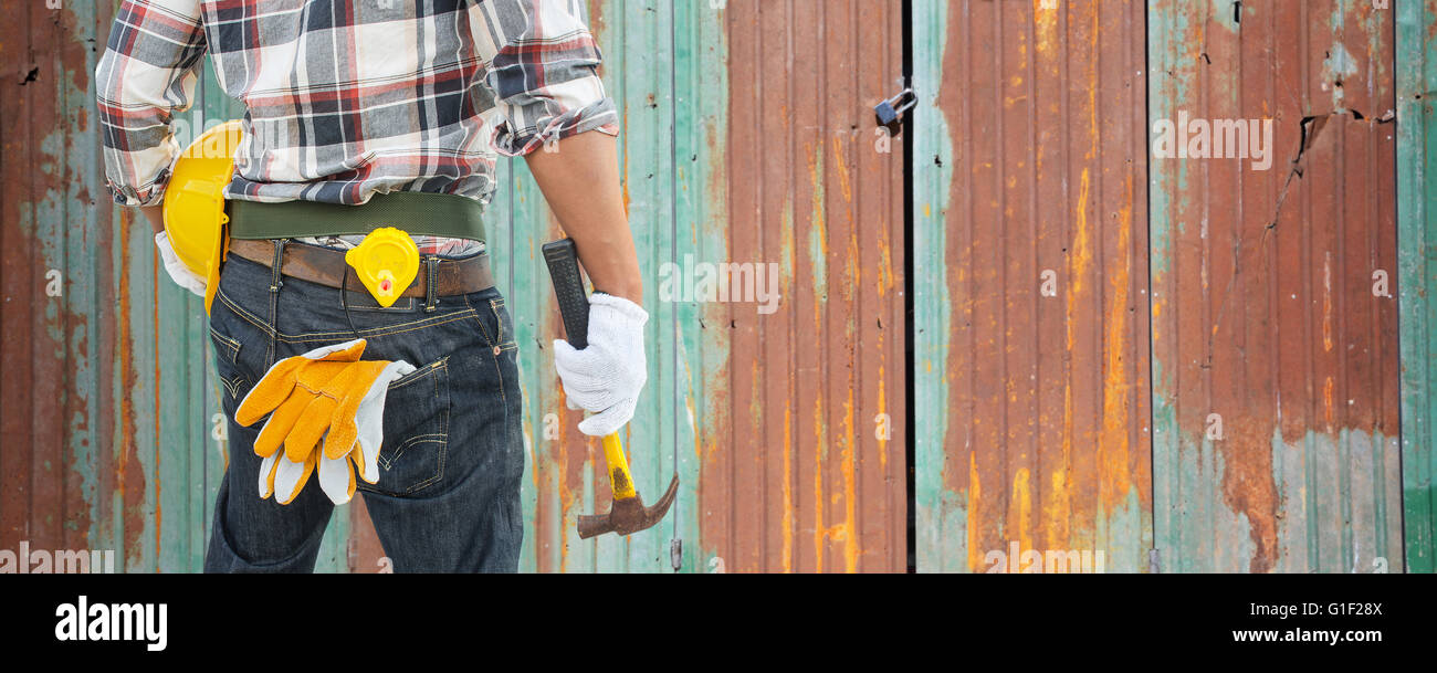 Builder handyman with construction tools Stock Photo - Alamy
