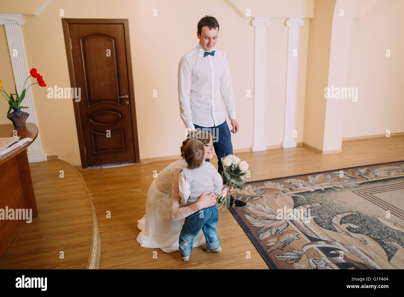 The beautiful bride embraces her little brother Stock Photo - Alamy