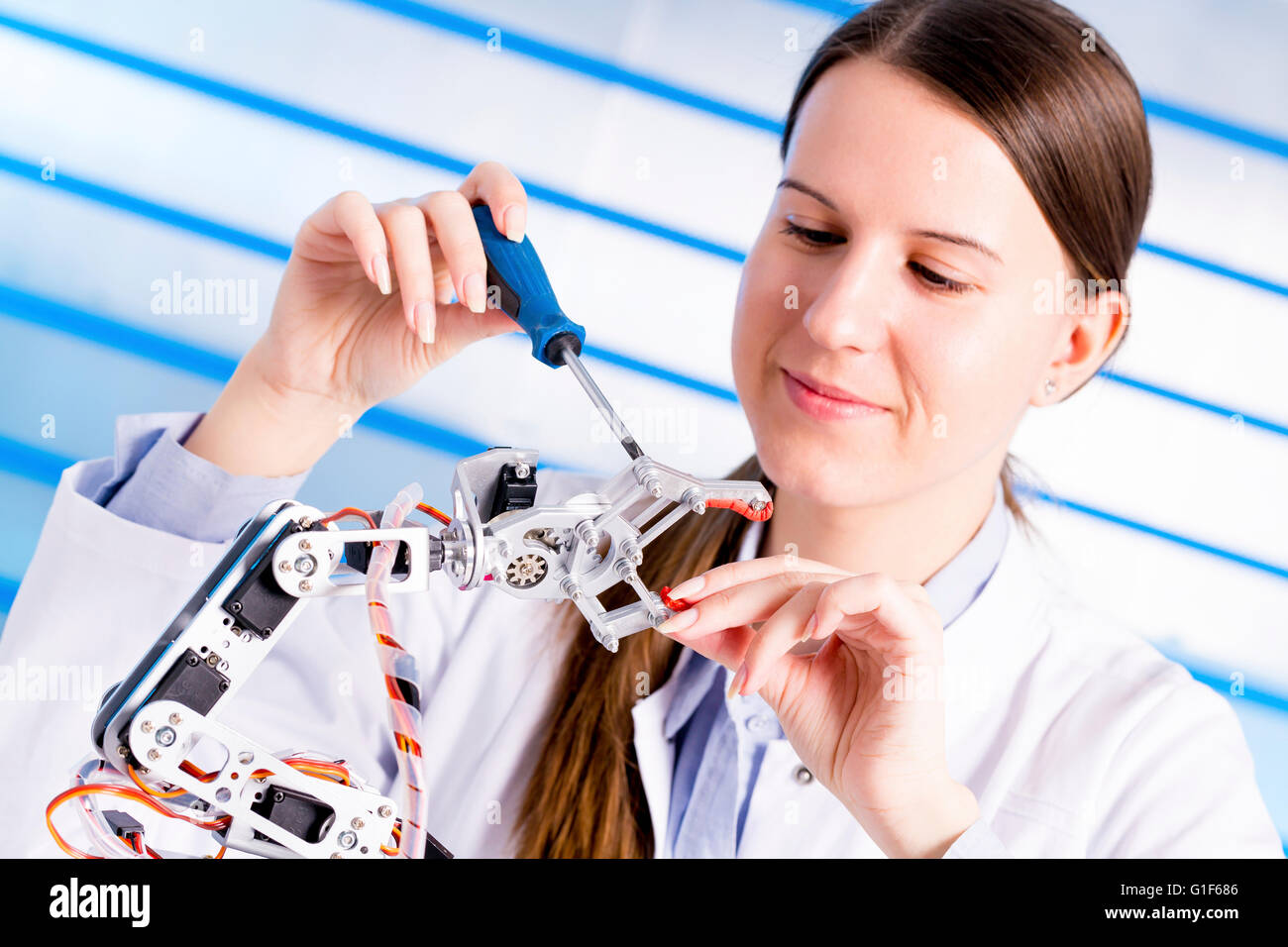 Female electrical engineer working on hi-res stock photography and ...