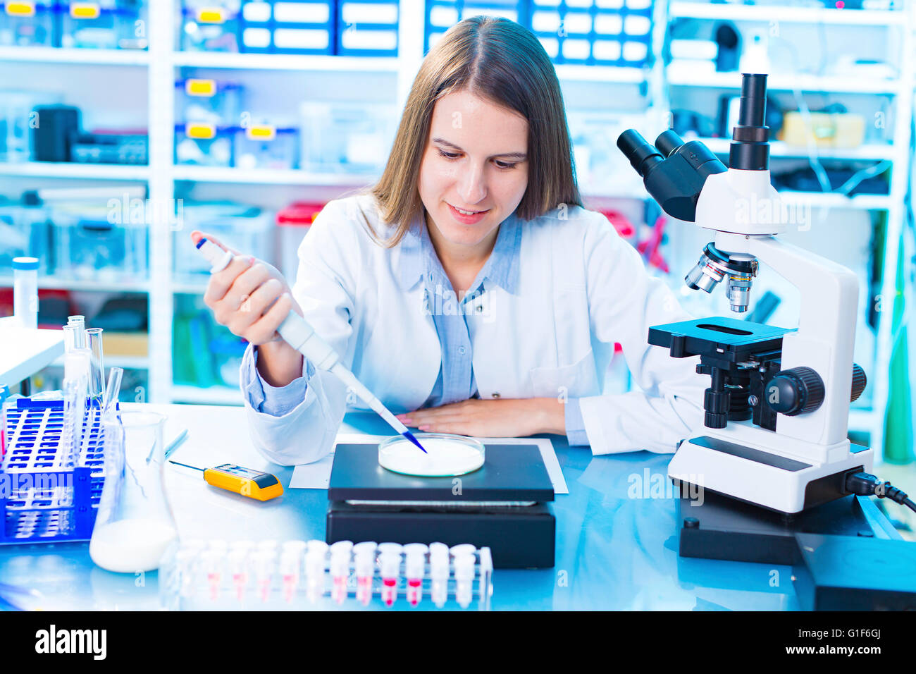 Women testing milk hi-res stock photography and images - Alamy