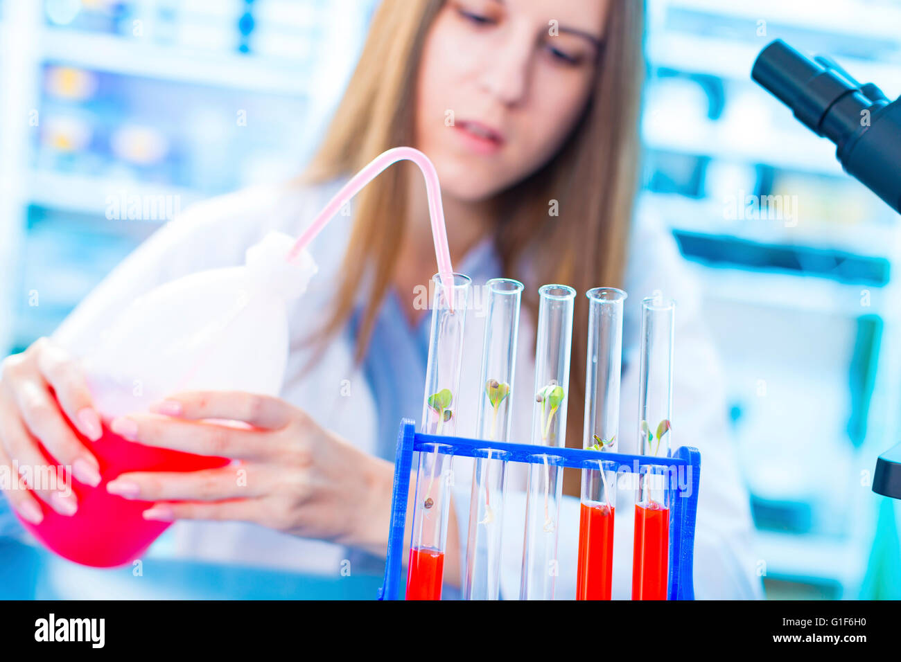 Tube squeezing hi-res stock photography and images - Alamy