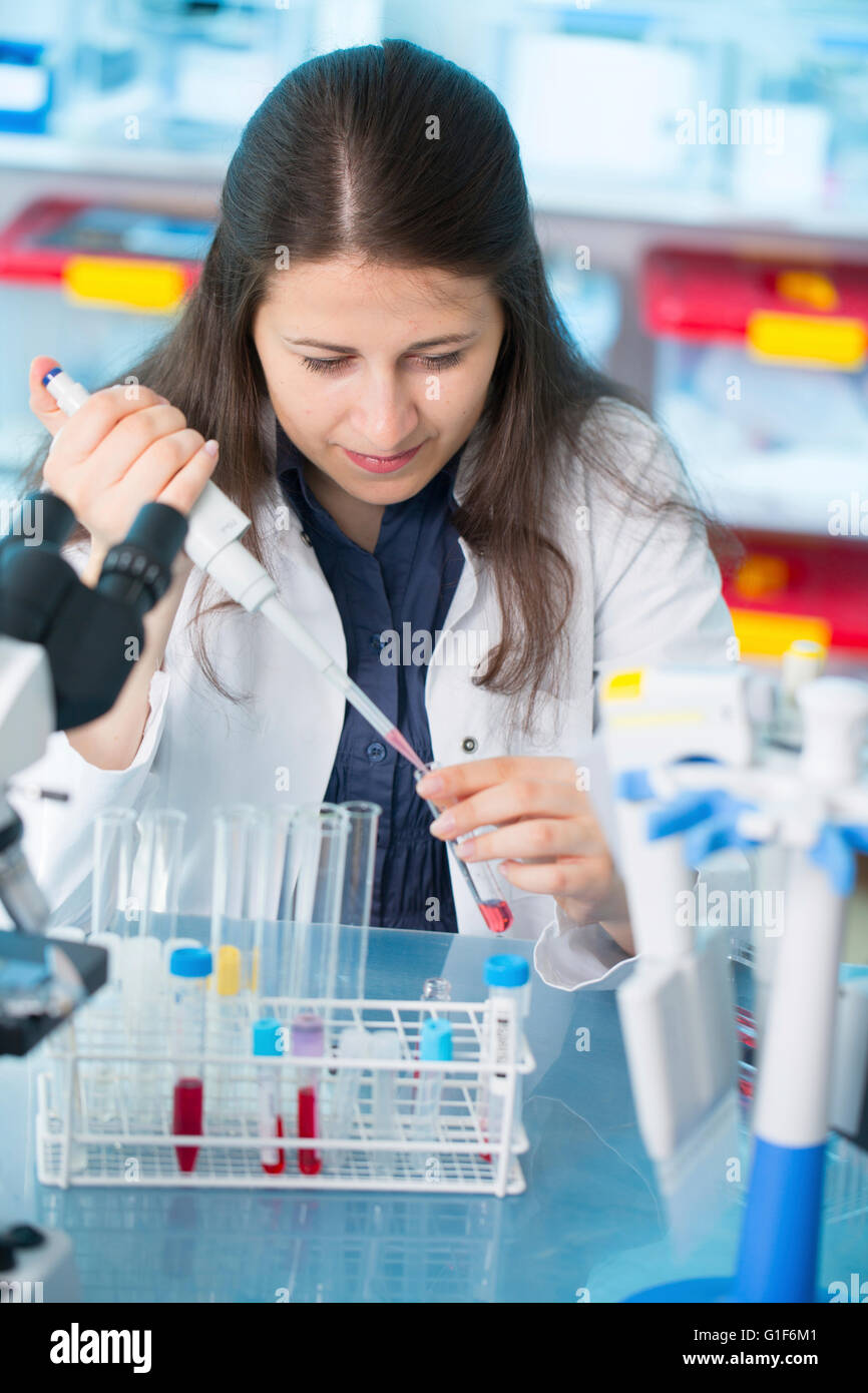 Lab technician using pipette hi-res stock photography and images - Alamy