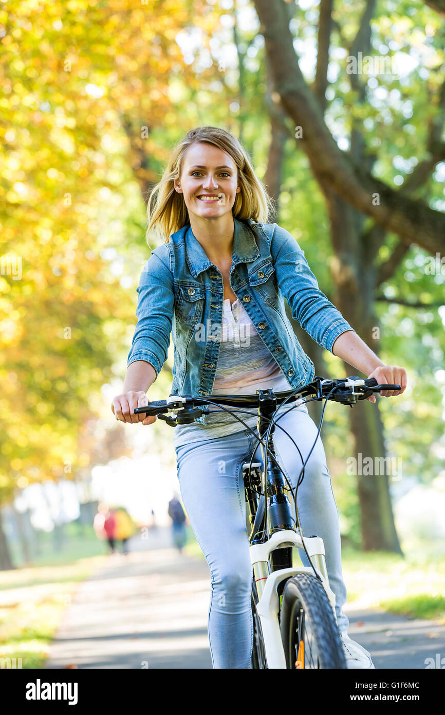 Woman riding a bicycle hi-res stock photography and images - Alamy