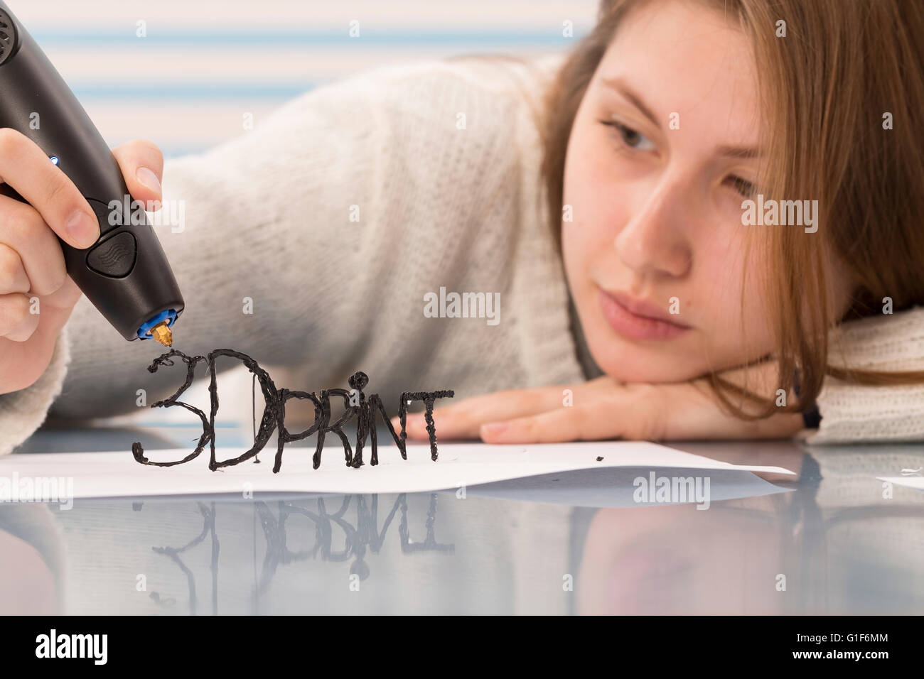 MODEL RELEASED. Young using 3D printing pen Stock Photo - Alamy