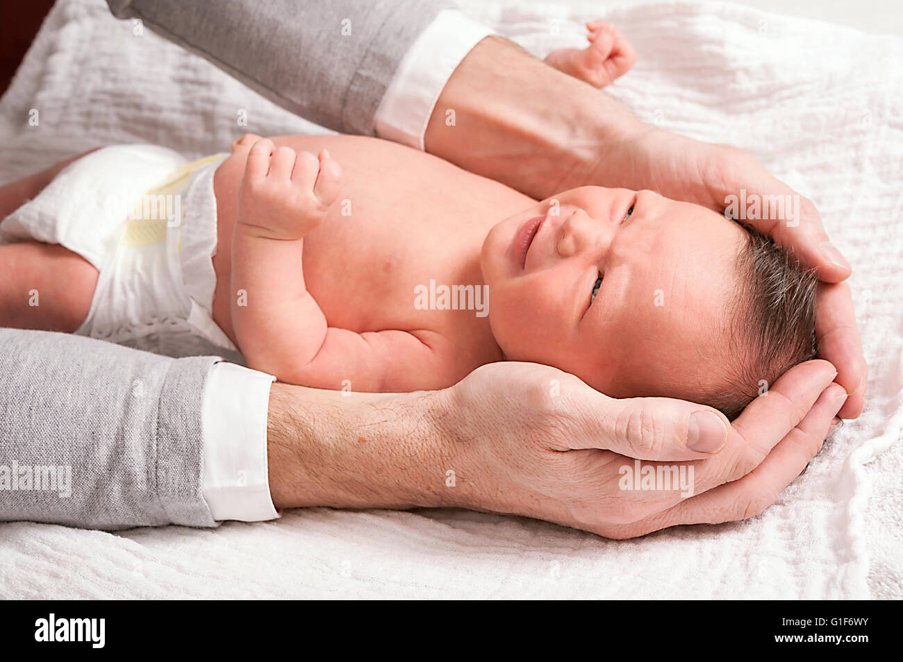 Touching her baby hi-res stock photography and images - Alamy