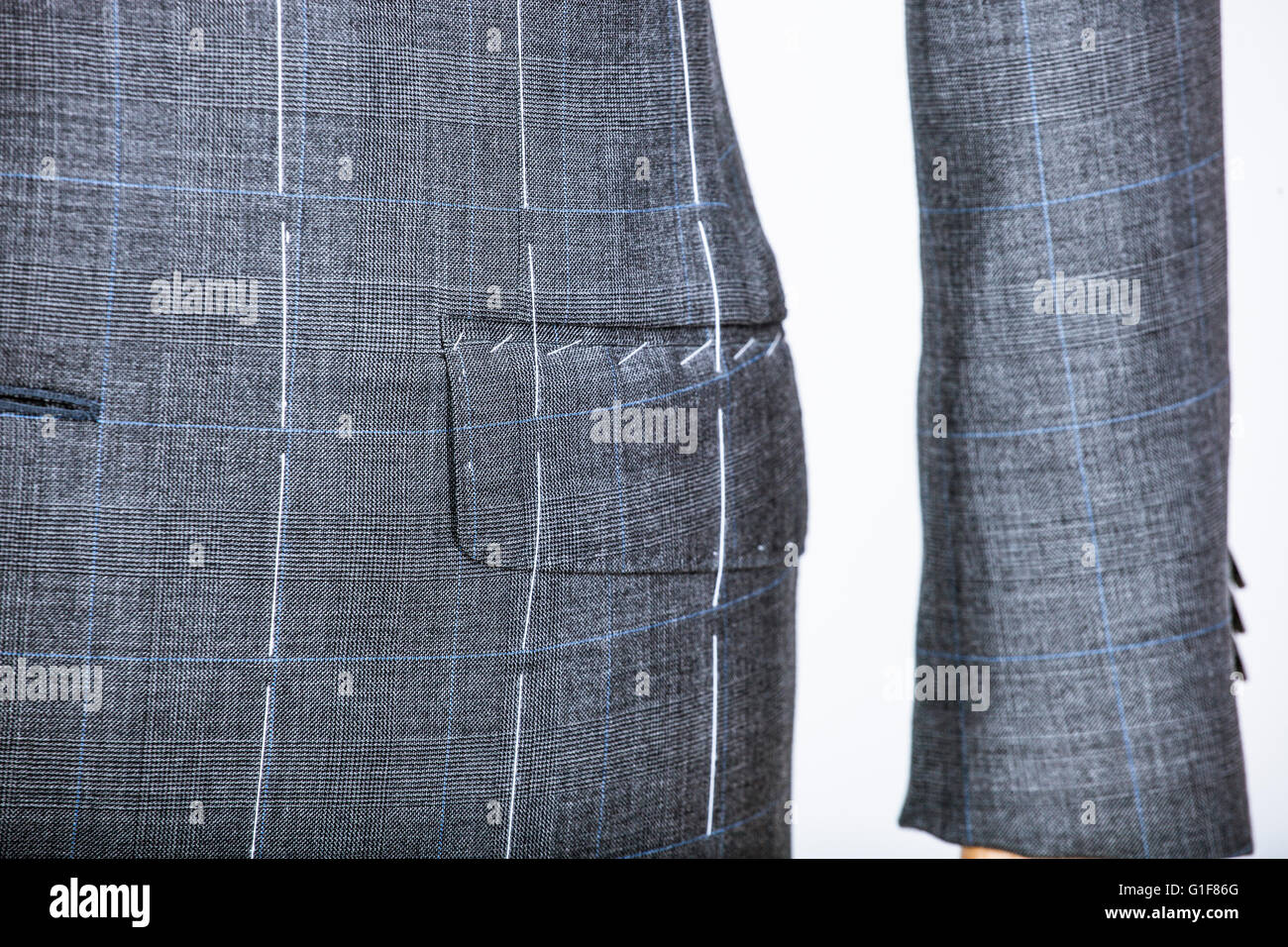 Details of a tailored suit jacket with markings on it for stitching ...