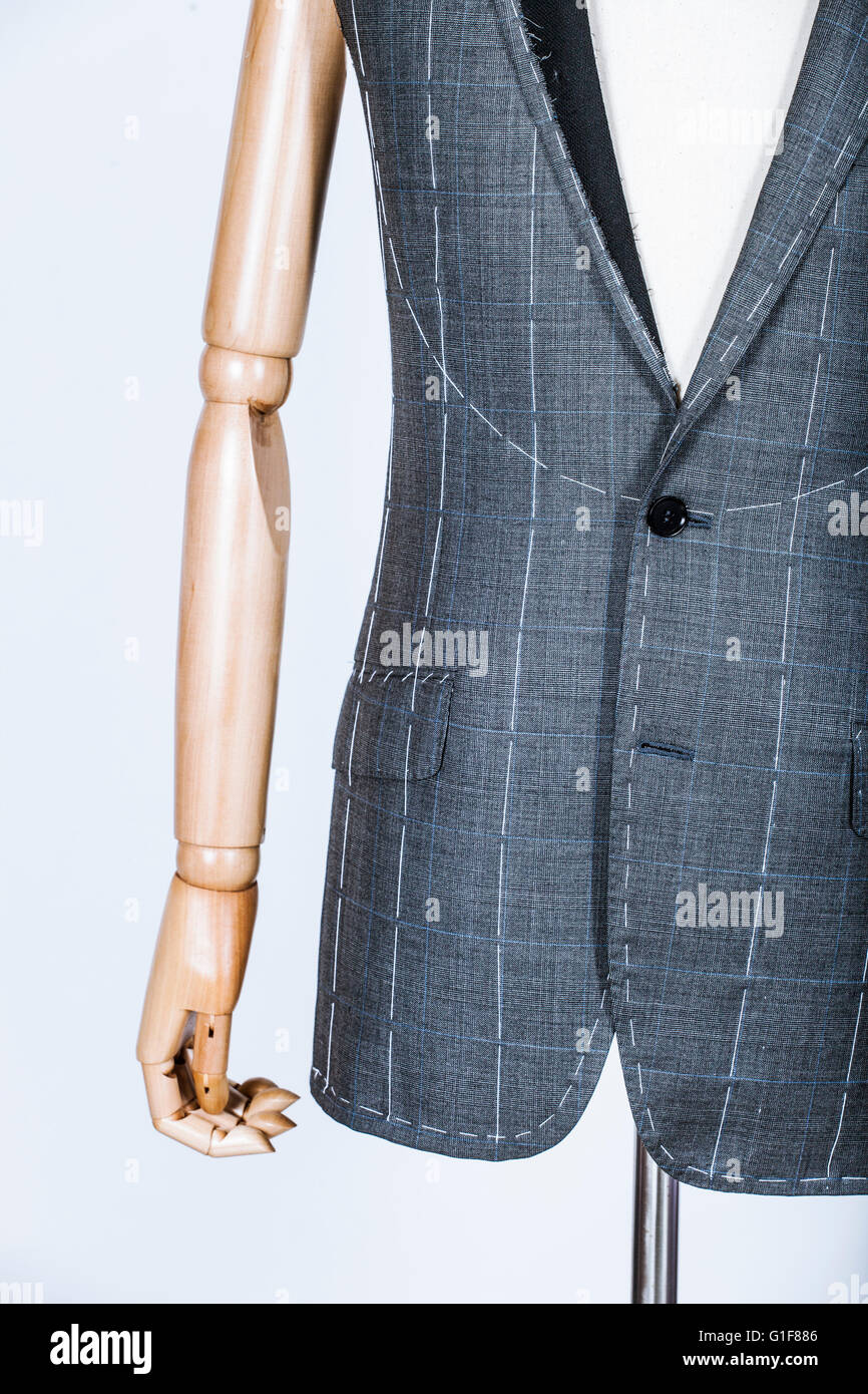 Details of a tailored suit jacket with markings on it for stitching ...