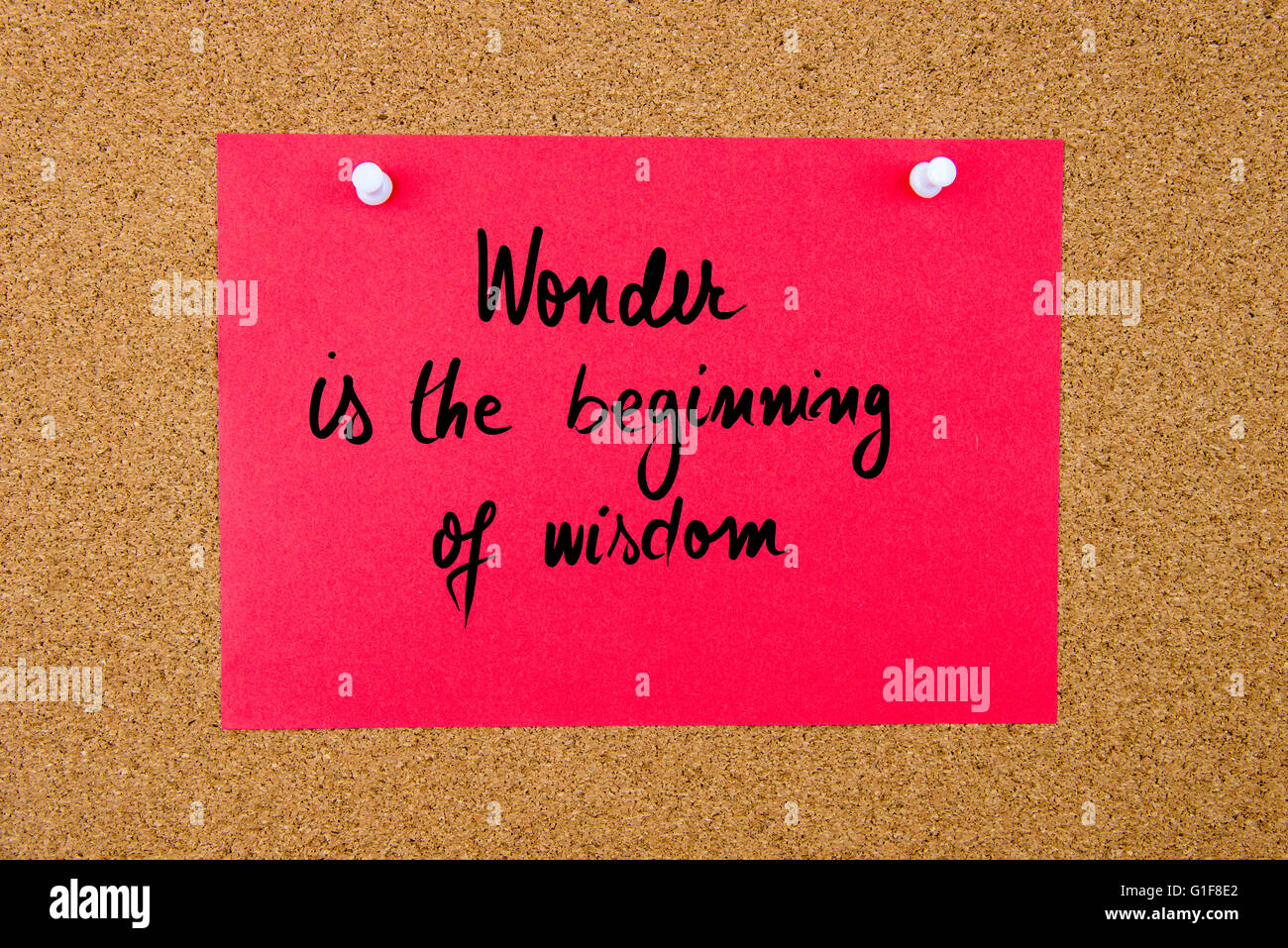 Red paper note with handwritten text Wonder Is The Beginning Of Wisdom ...