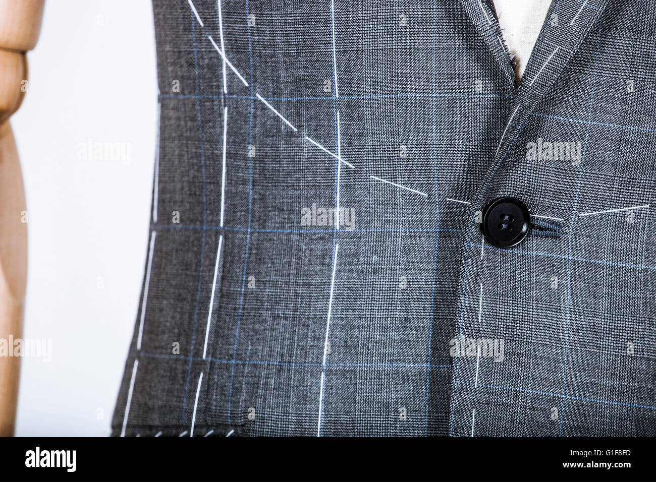 Details of a tailored suit jacket with markings on it for stitching ...