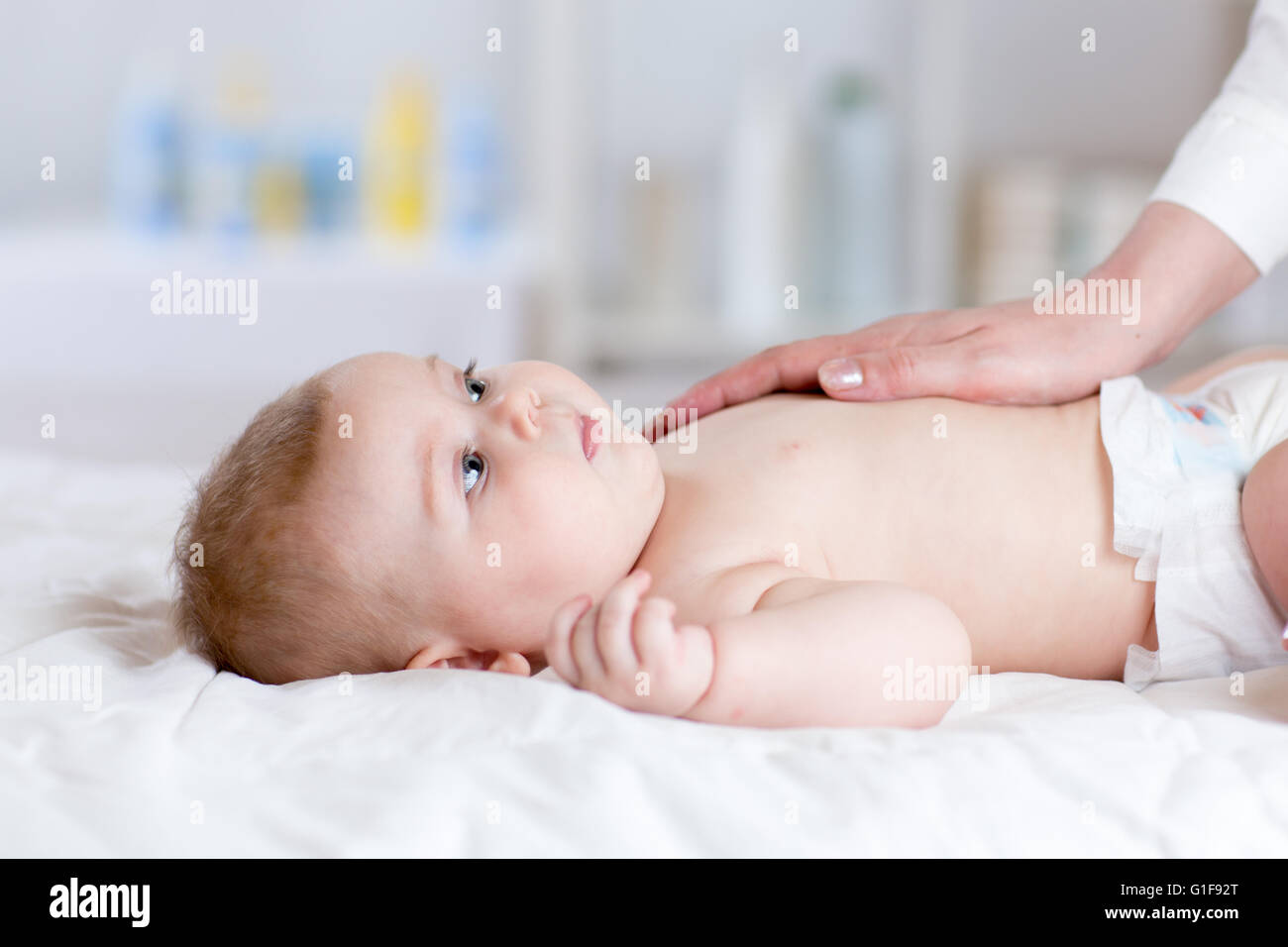Female hand with baby Stock Photo - Alamy