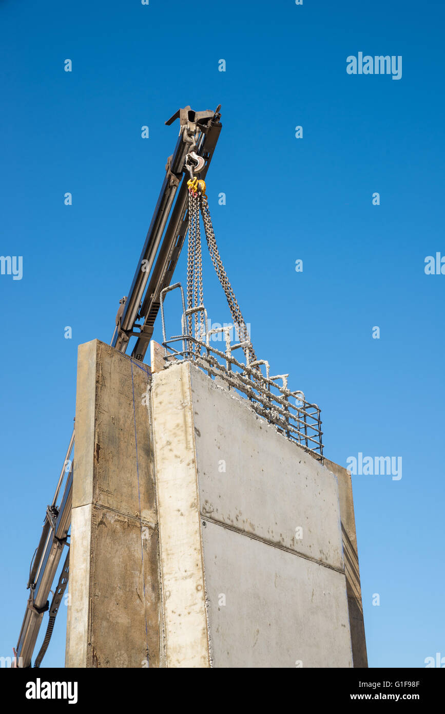 Crane removing formwork encasement from a finished wall Stock Photo - Alamy