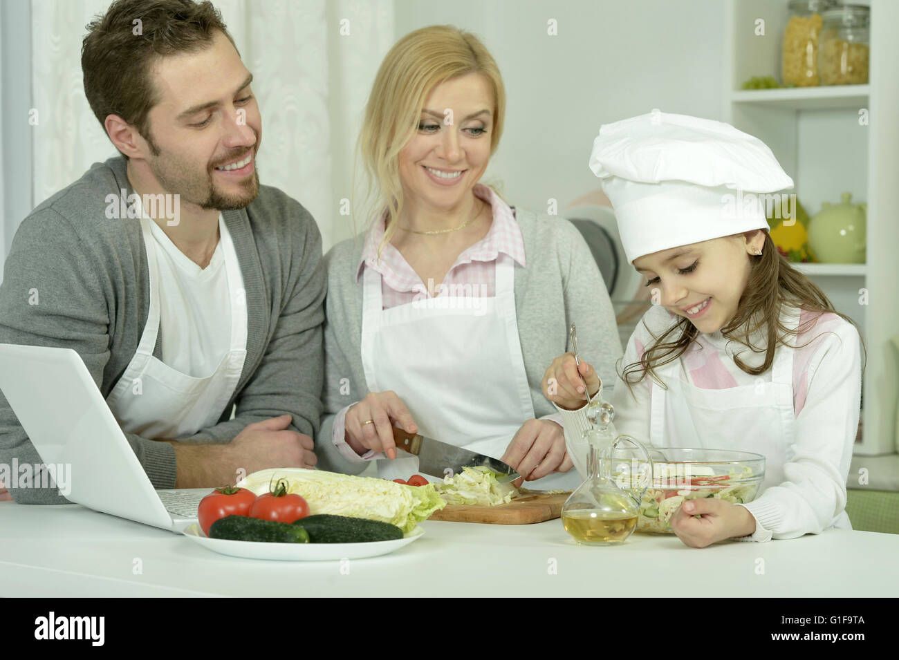 happy family cooking in kitchen Stock Photo - Alamy