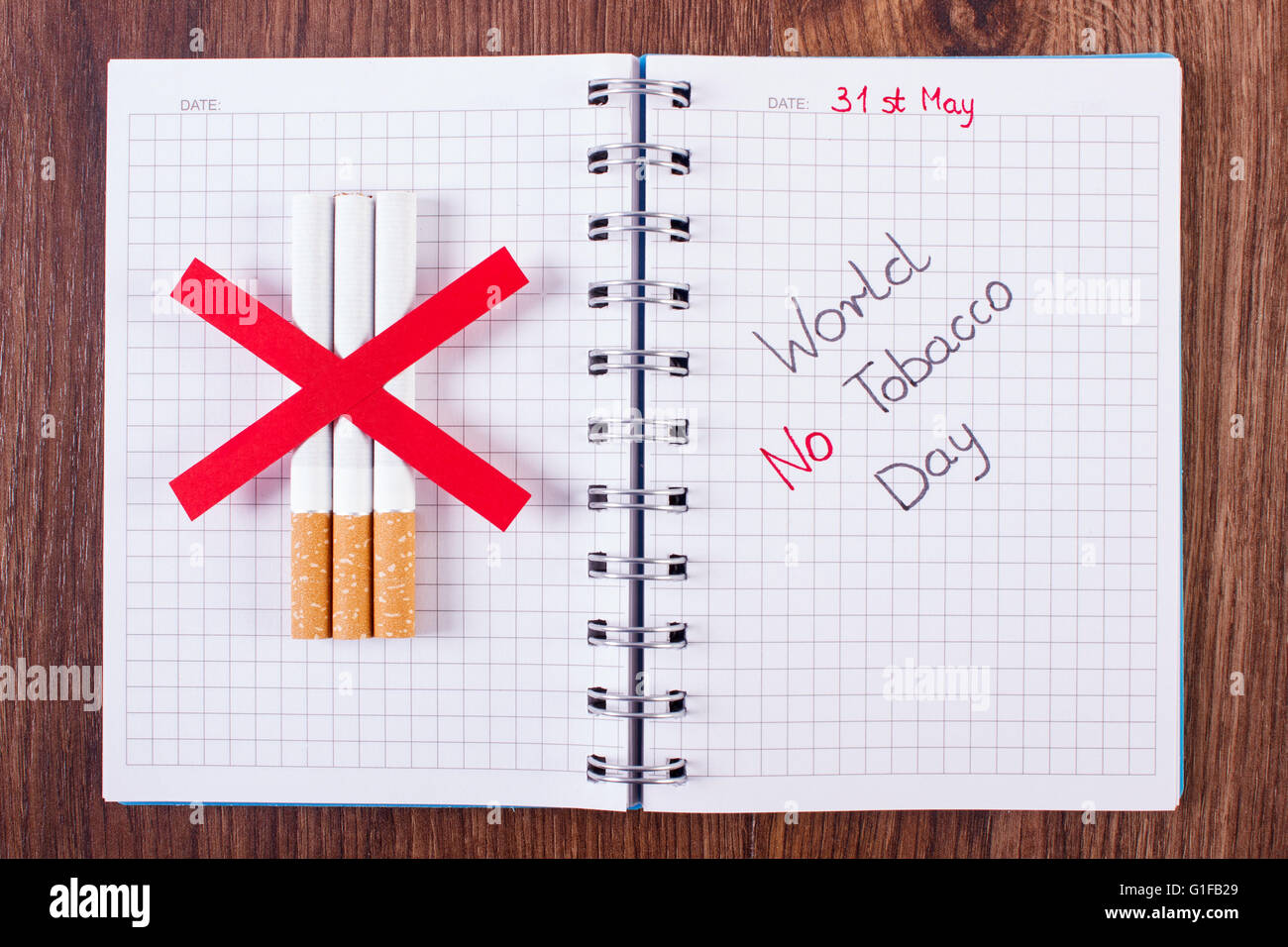 Cigarettes and inscription world no tobacco day written in notebook ...