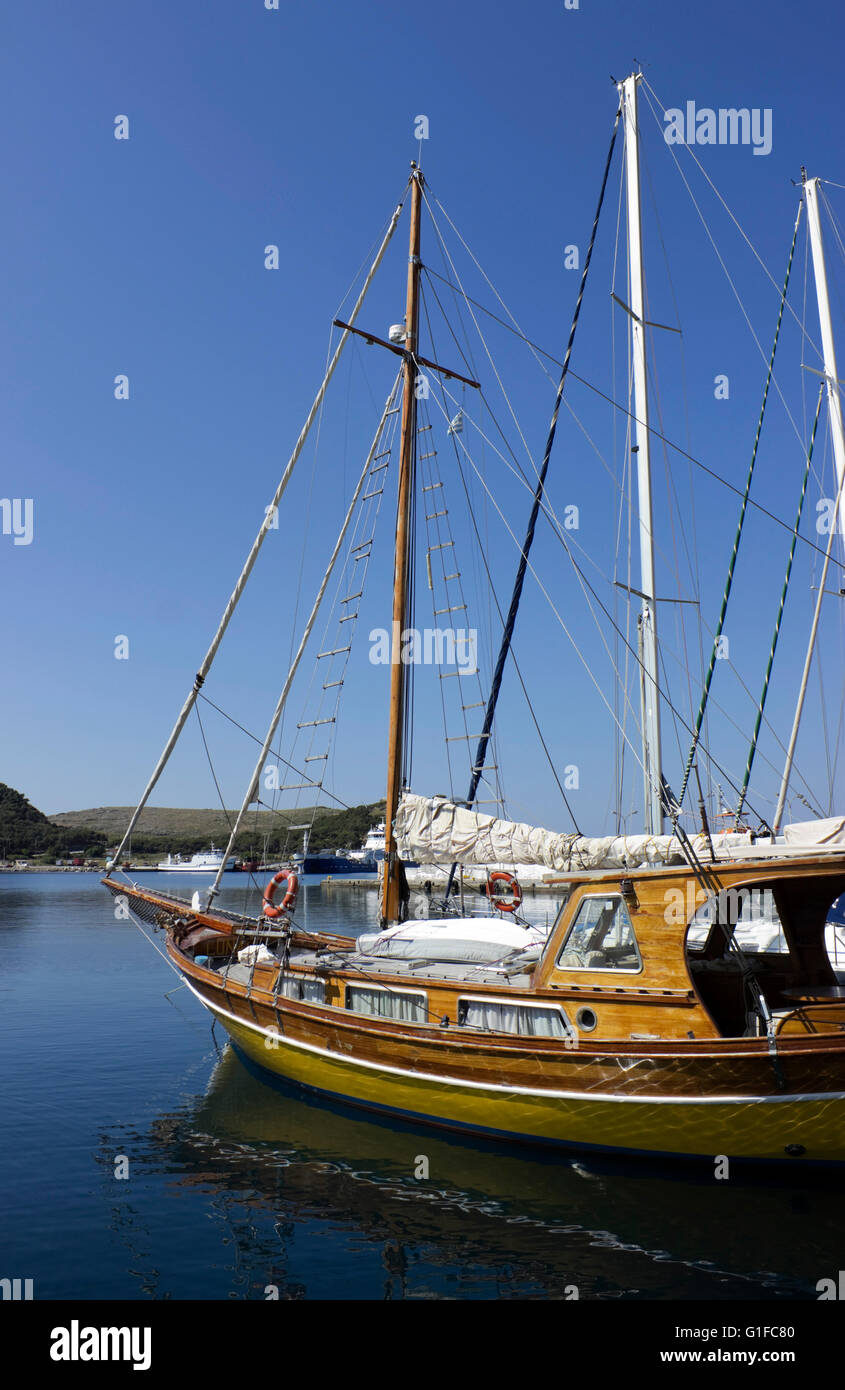 Close view of a luxurious wooden private sailing clipper anchored in ...