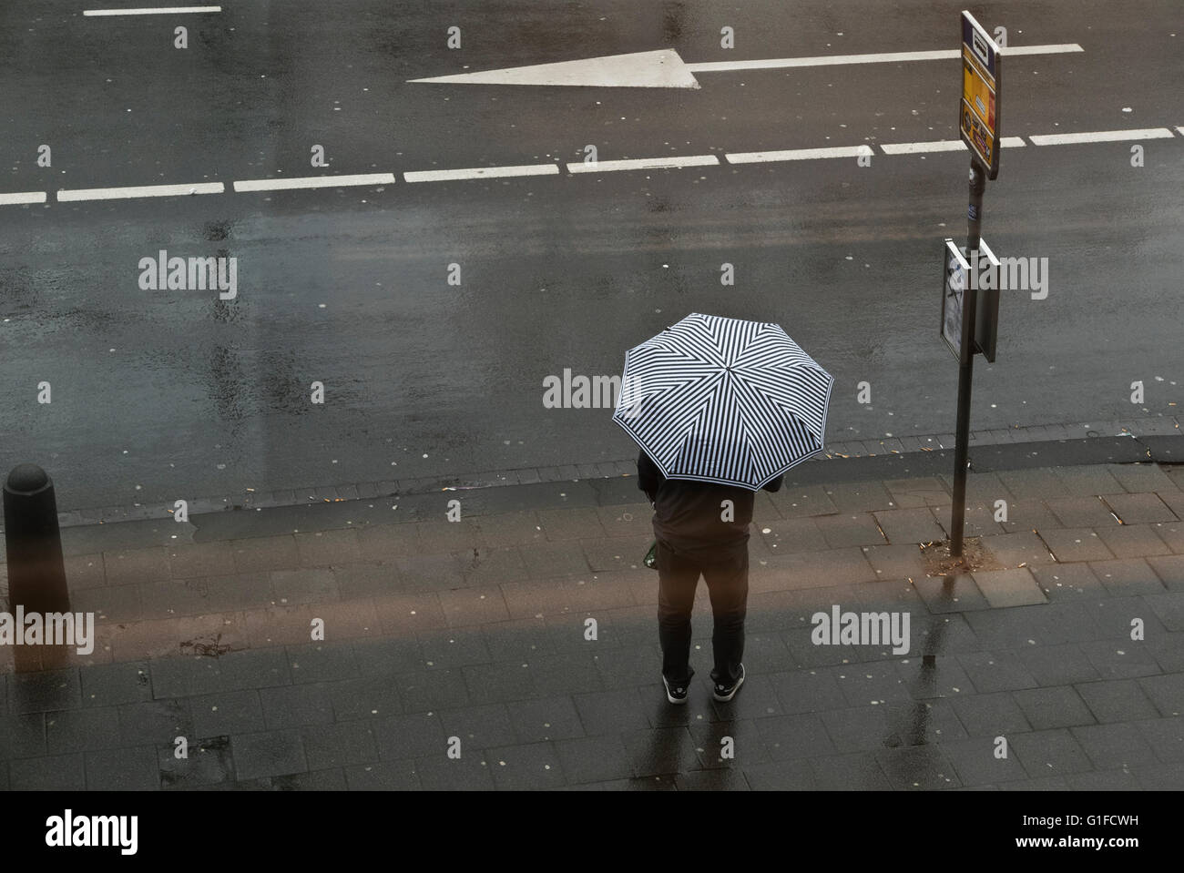 Man Waiting In Rain