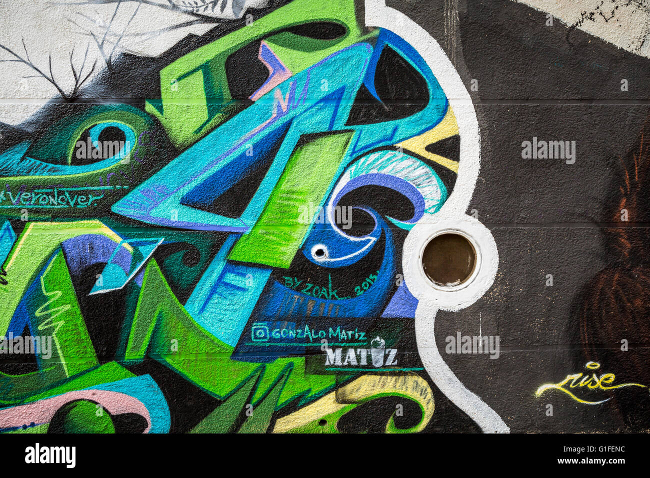 Street art, graffiti and artwork on the walls of shops and buildings ...