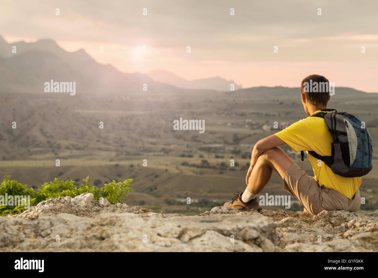 Hiker sitting sunset hi-res stock photography and images - Alamy
