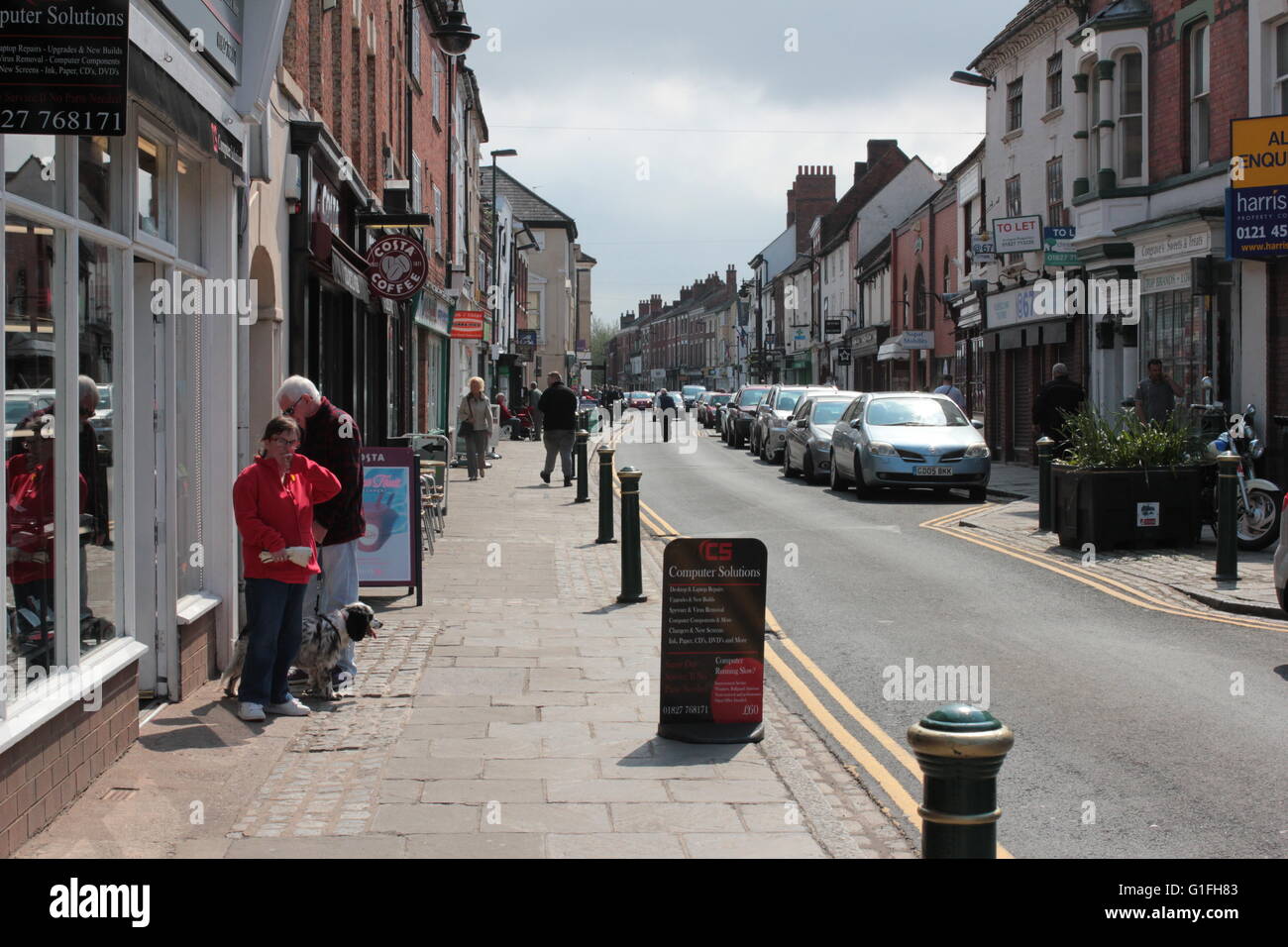 British street scene with people, cars and shops Stock Photo: 104219699 ...