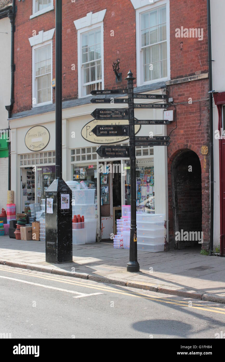 street with sign post and shops Stock Photo - Alamy