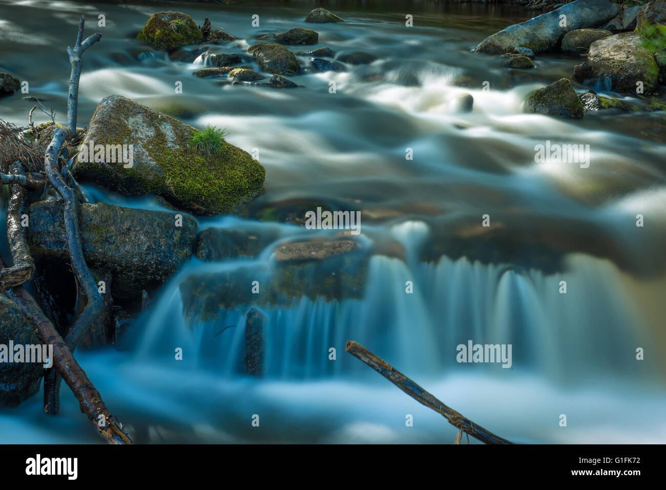 Small stream with waterfalls in the woods Stock Photo - Alamy