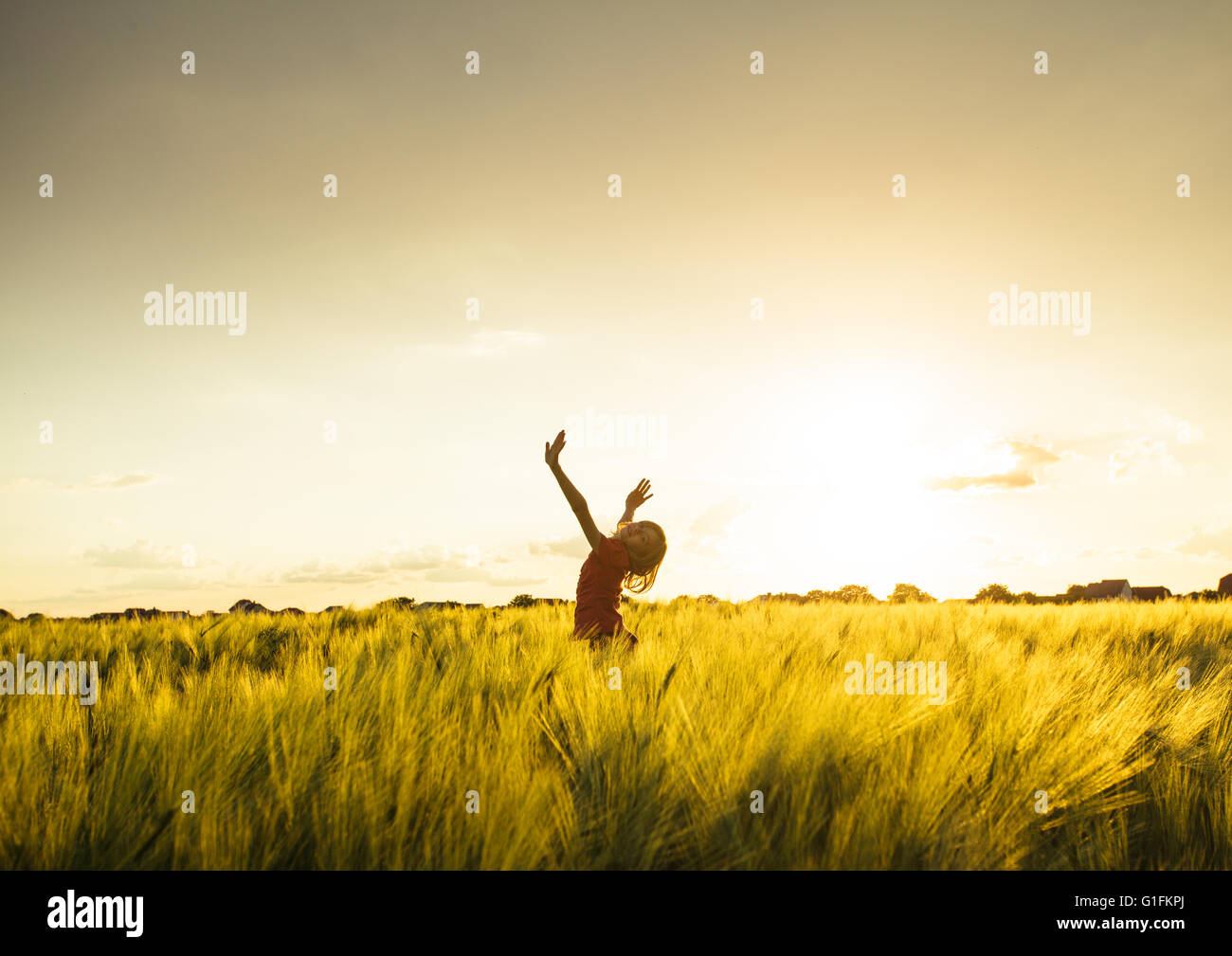 Girl on sunset Stock Photo - Alamy