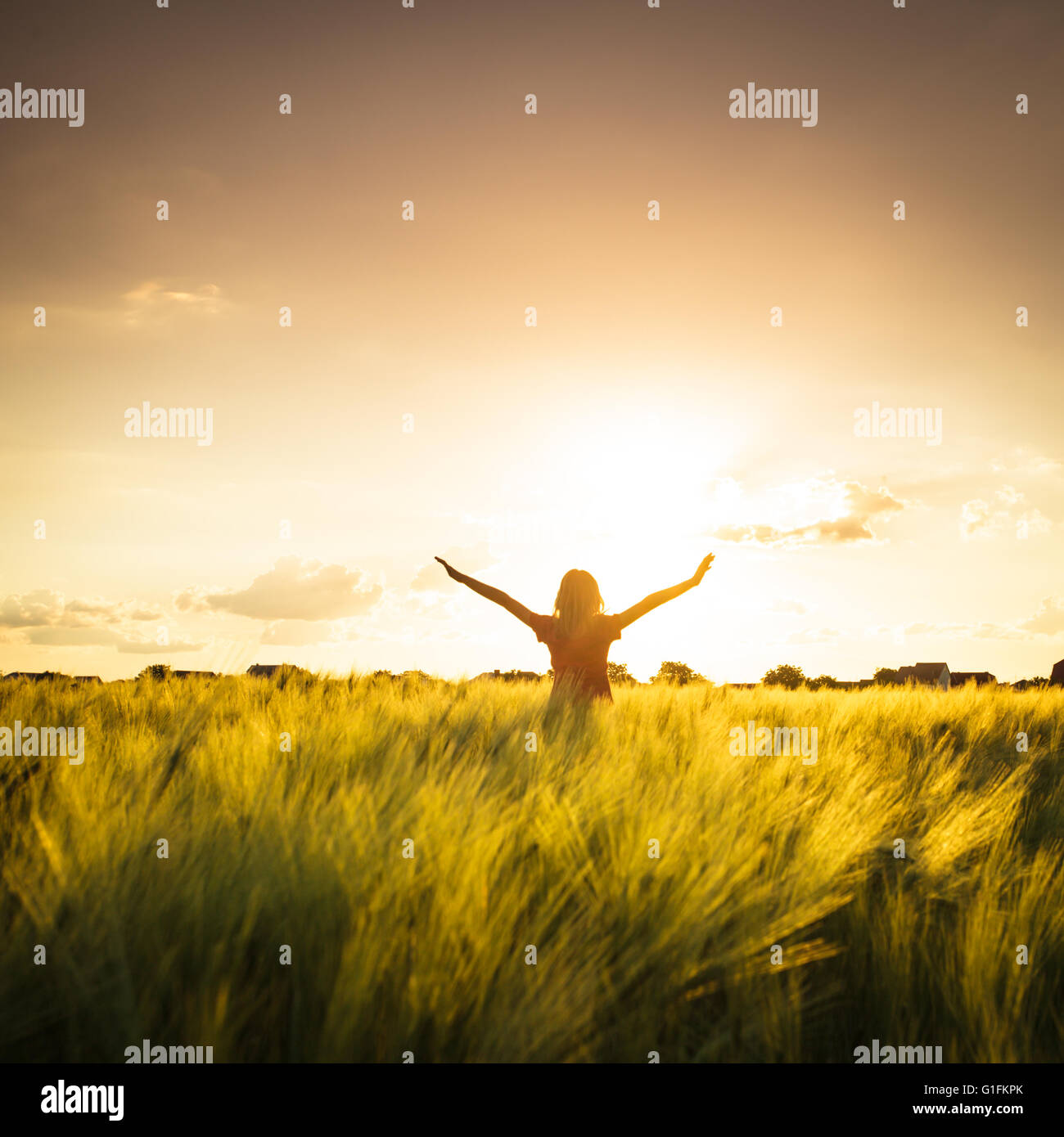 Girl on sunset Stock Photo - Alamy
