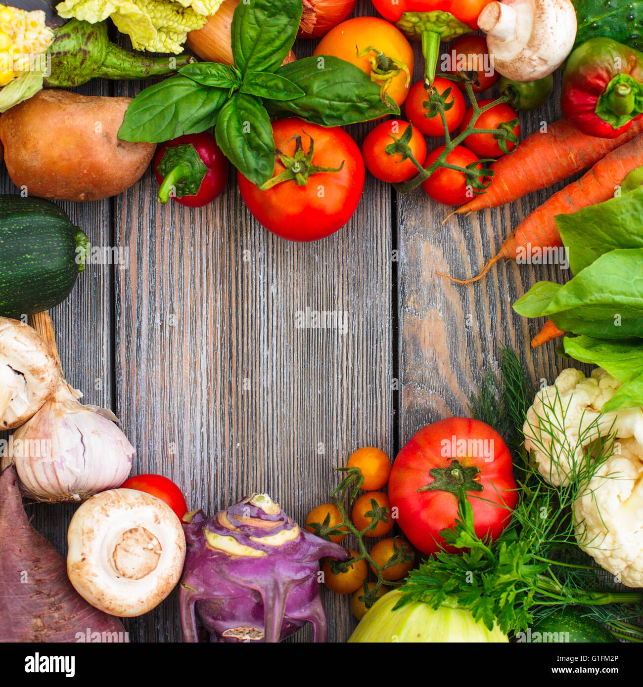 Vegetables on wooden table Stock Photo - Alamy