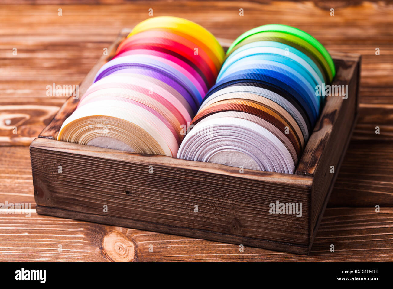 ribbon bobbins in box Stock Photo - Alamy