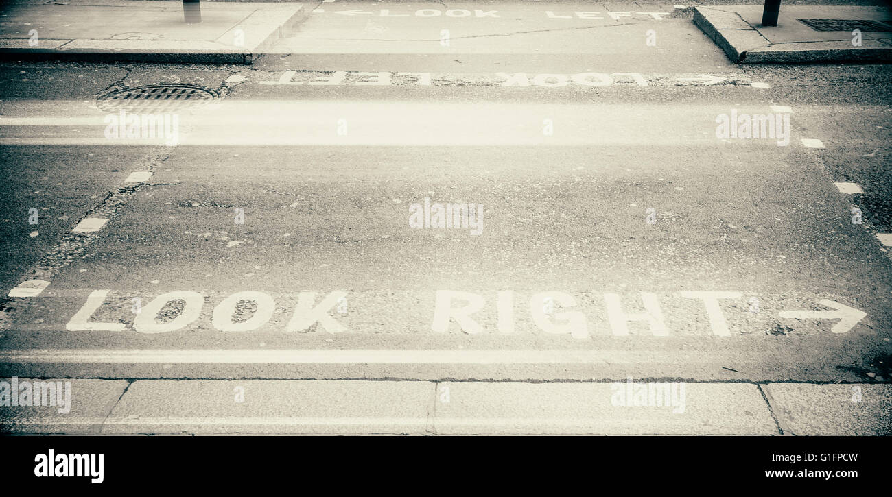 Look right warning painted on a pedestrian crossing in London, England ...