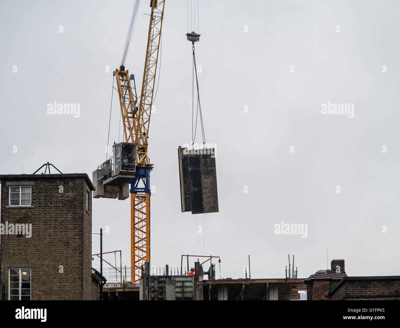 Crane lifting building materials on hi-res stock photography and images ...