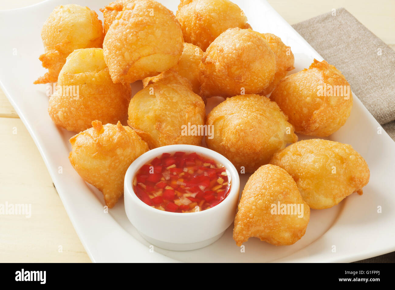 Cheddar cheese Beignets with chilli dipping sauce Stock Photo - Alamy