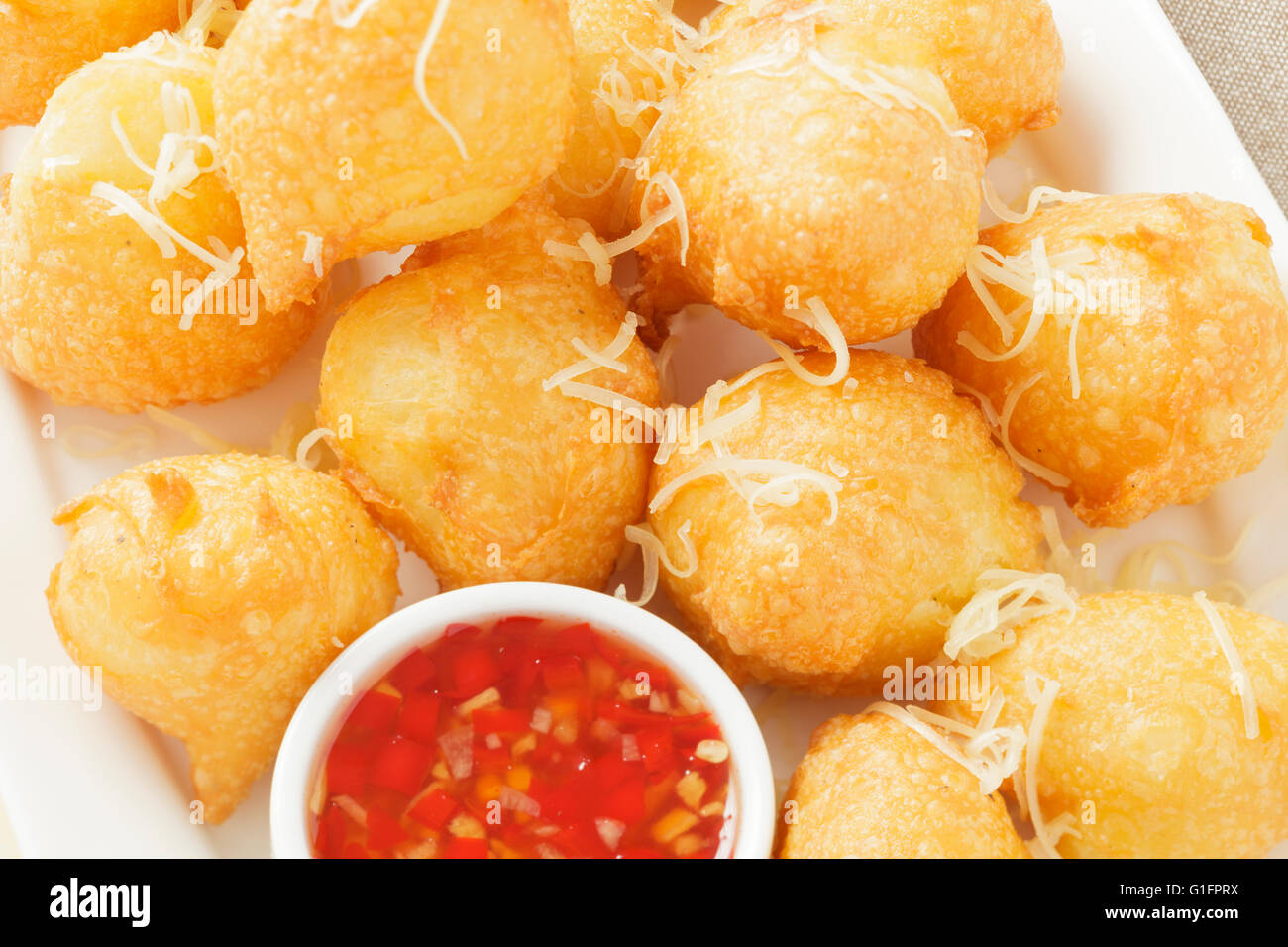 Cheddar cheese Beignets with chilli dipping sauce Stock Photo - Alamy