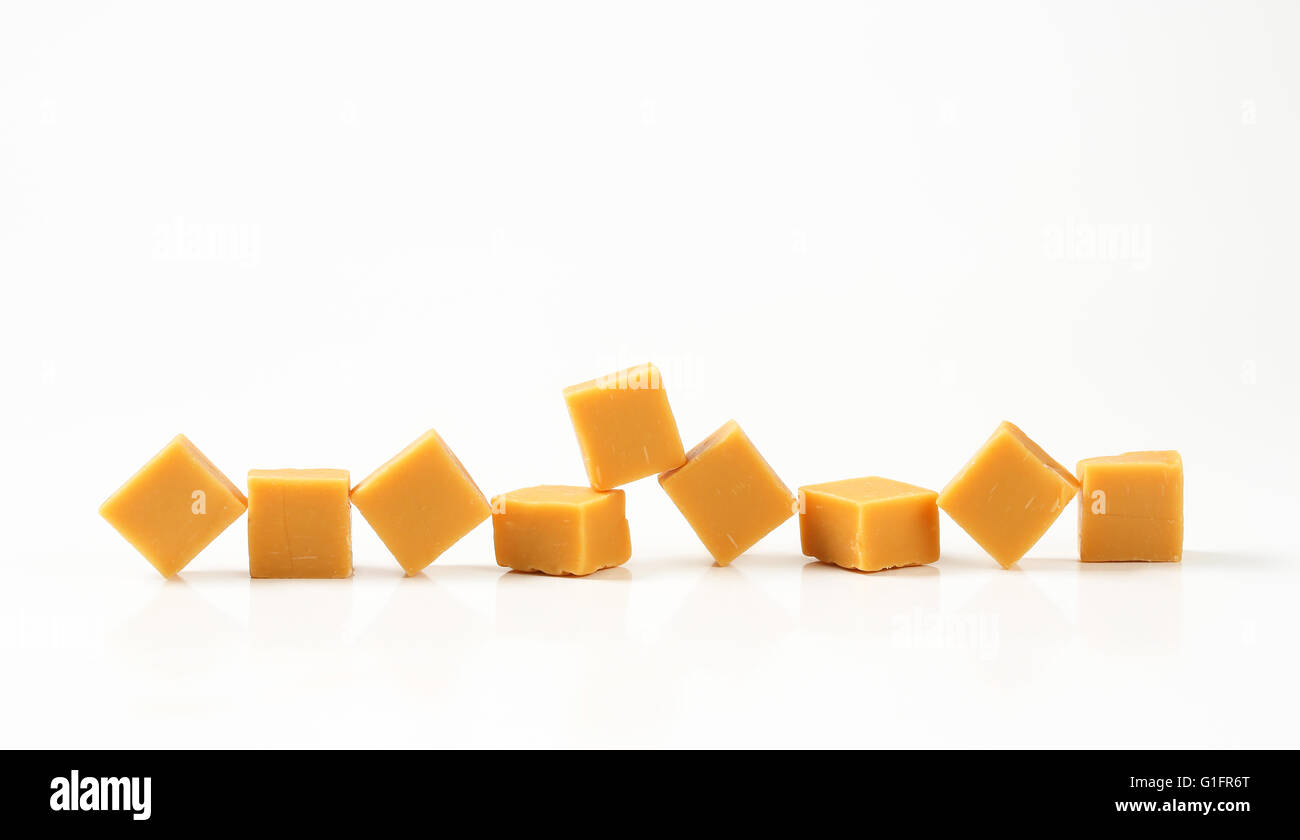 Chewy toffee candies on white background Stock Photo - Alamy