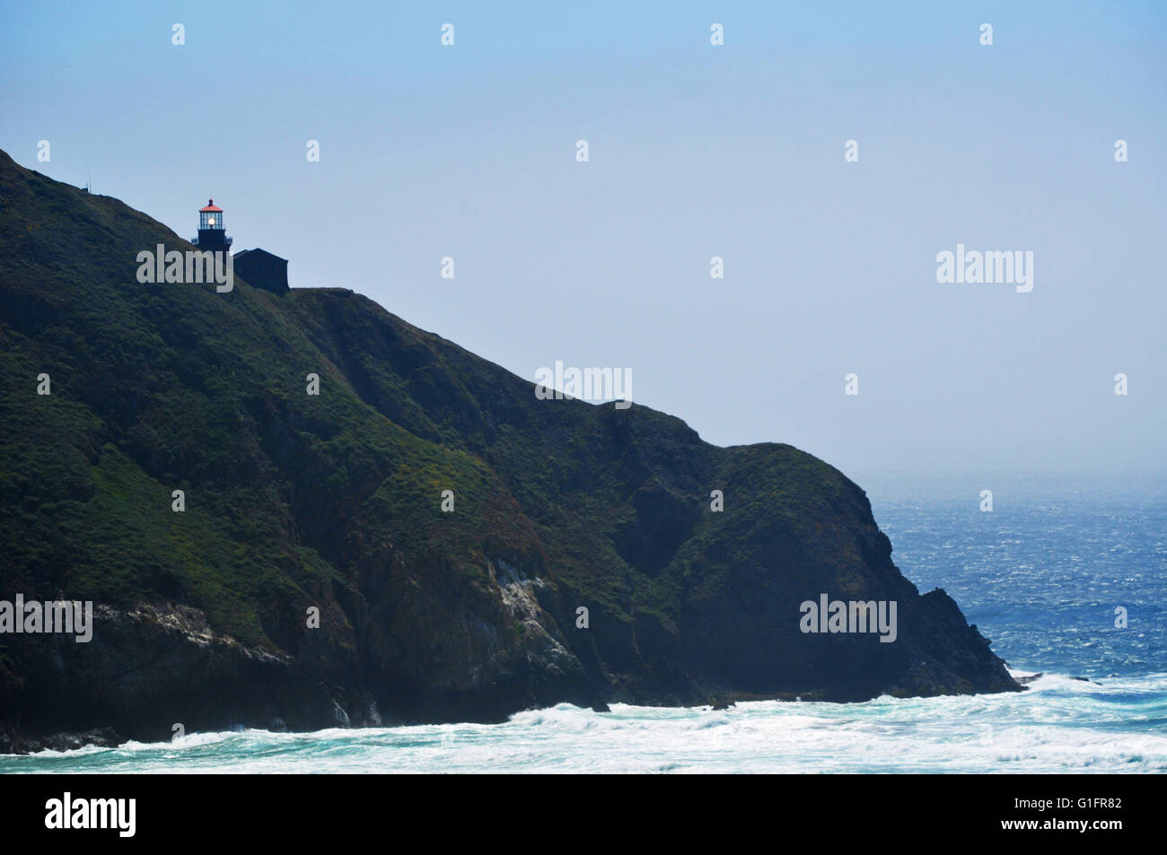 California, big Sur: view through the fog of Point Sur Light Station ...