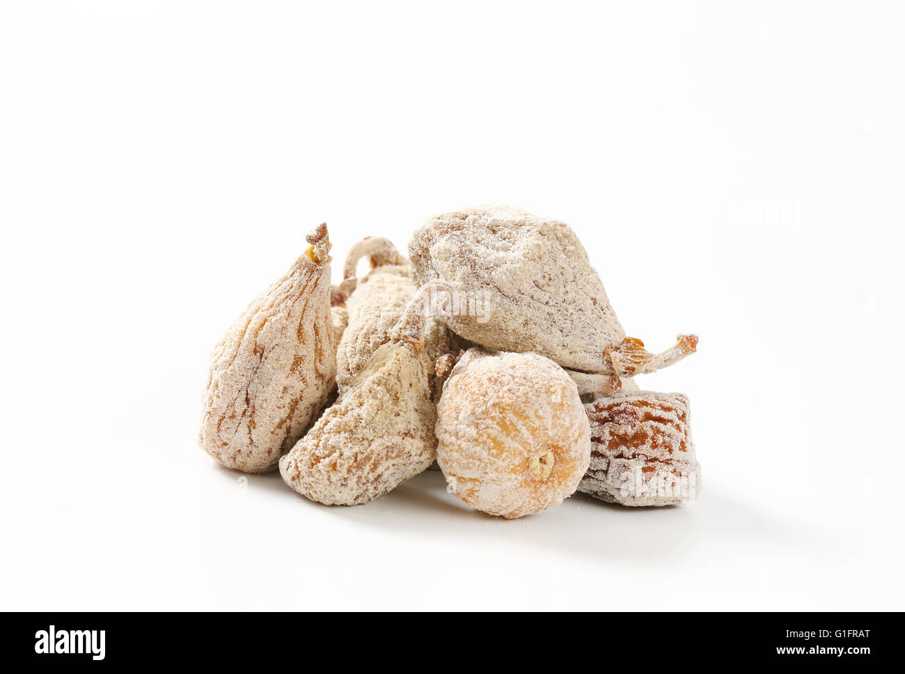 heap of candied dry figs on white background Stock Photo - Alamy