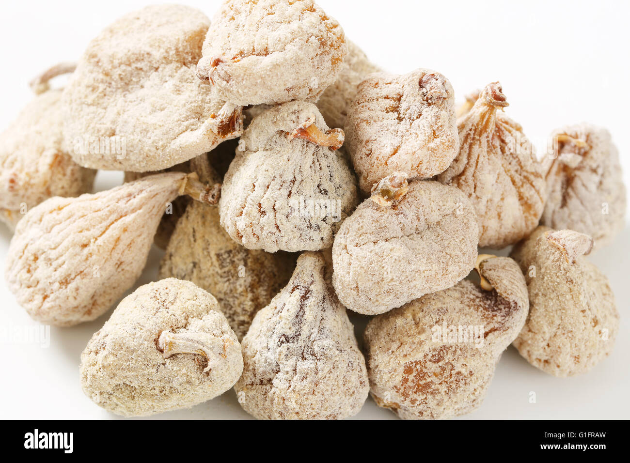 heap of candied dry figs on white background - close up Stock Photo - Alamy