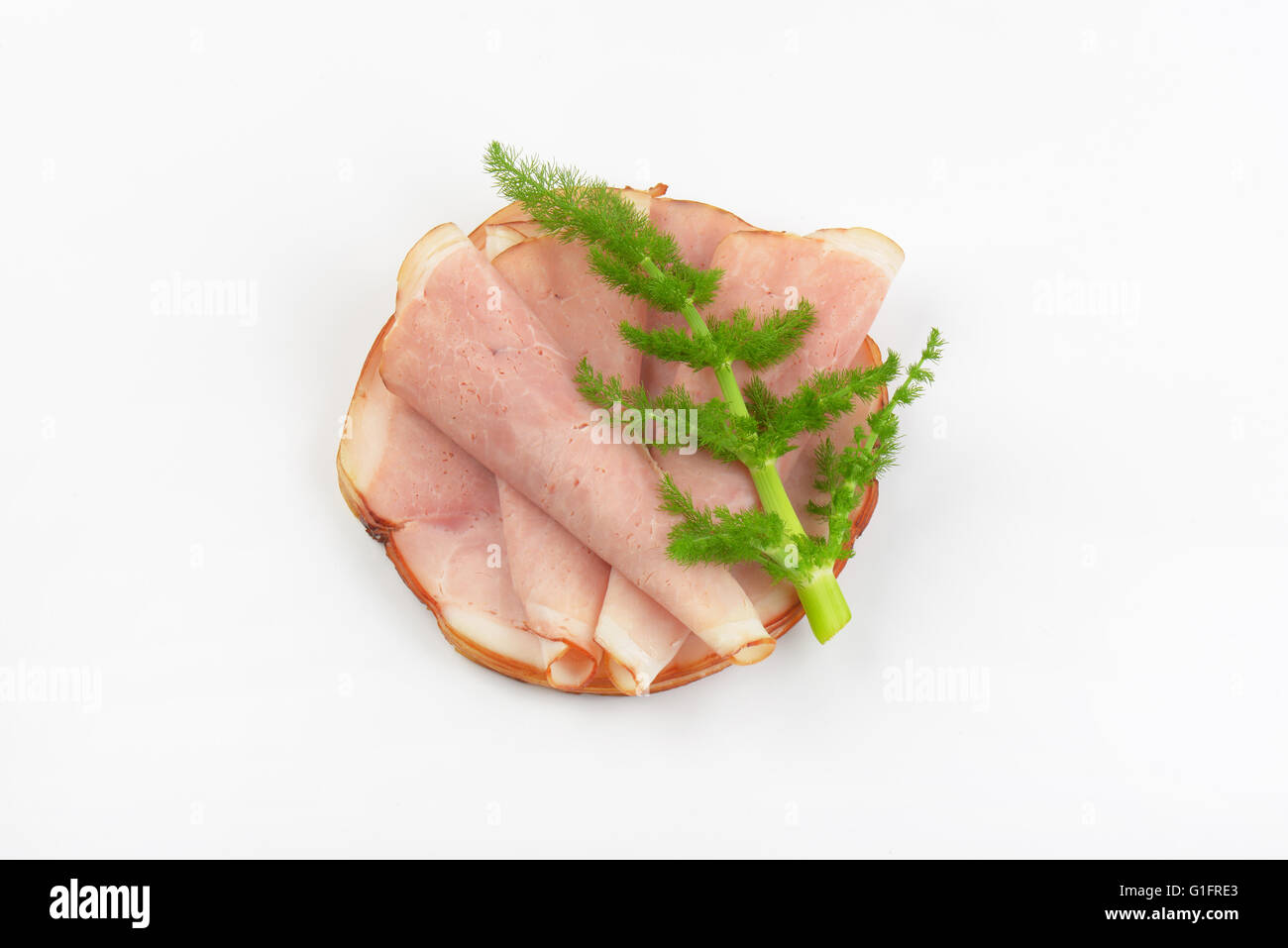 stack of ham slices and dill on white background Stock Photo - Alamy