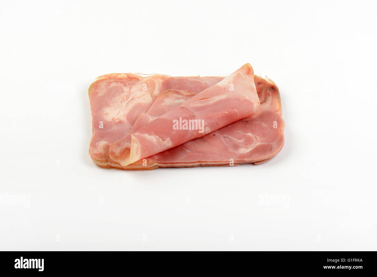 slices of pork ham on white background Stock Photo - Alamy