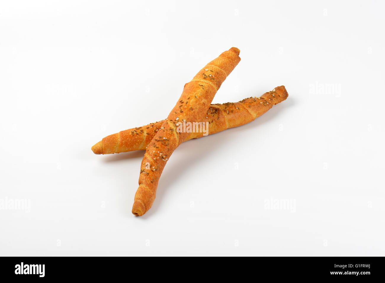 two salty long rolls on white background Stock Photo - Alamy