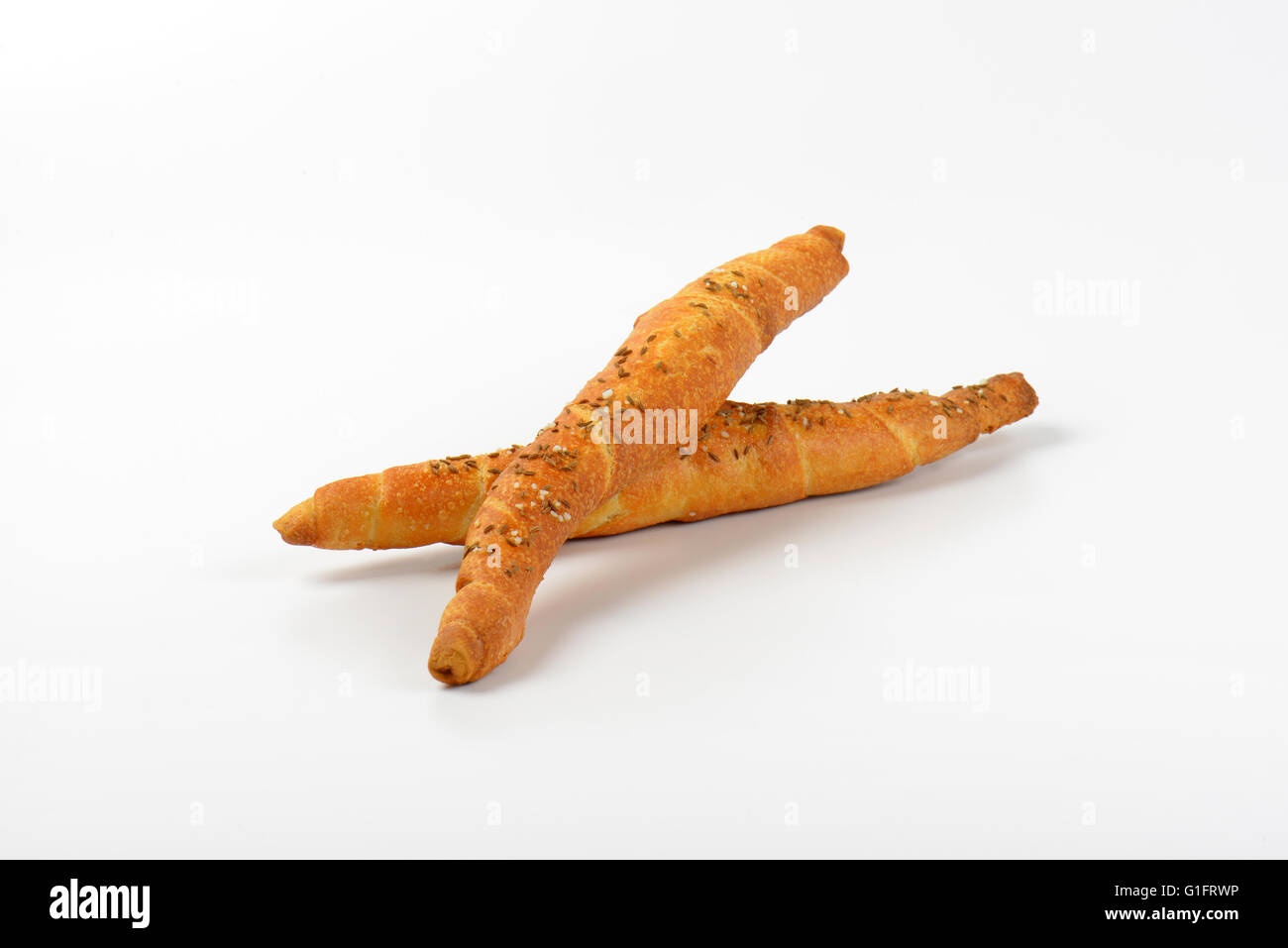 two salty long rolls on white background Stock Photo - Alamy