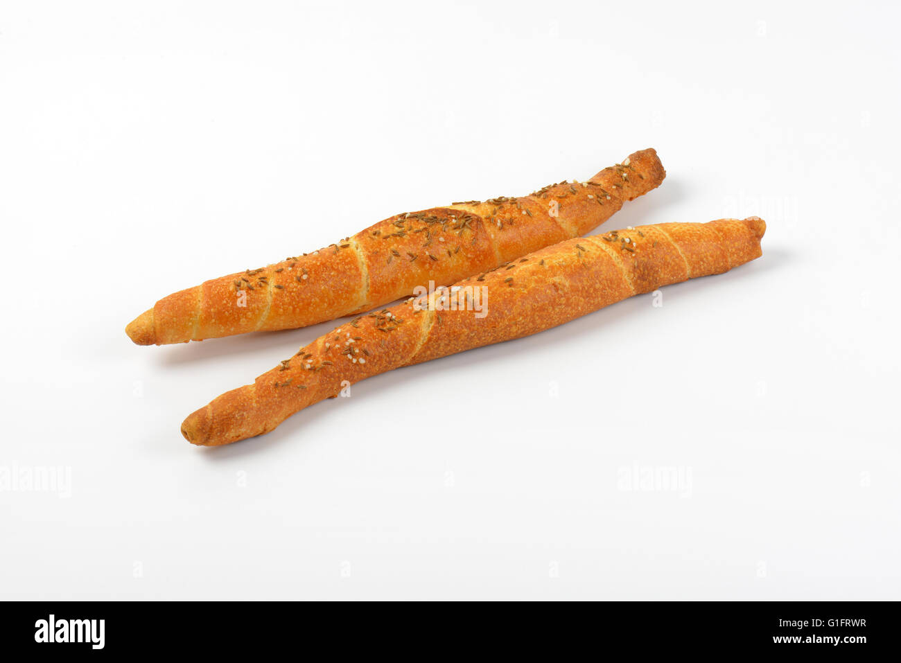 two salty long rolls on white background Stock Photo - Alamy