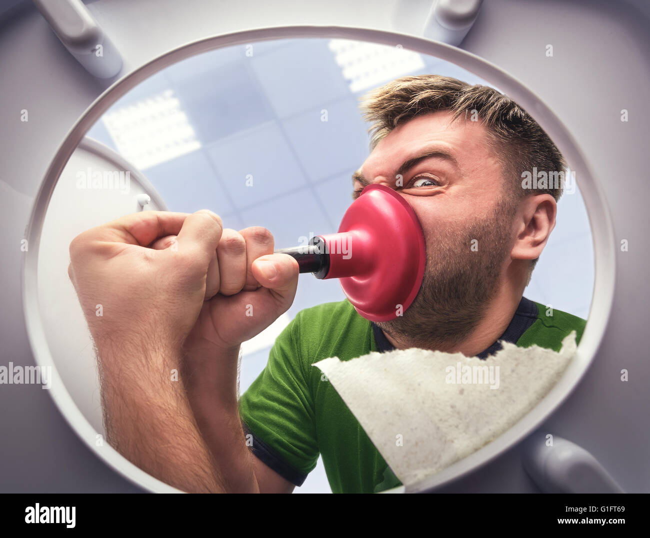 Man with cup plunger Stock Photo - Alamy
