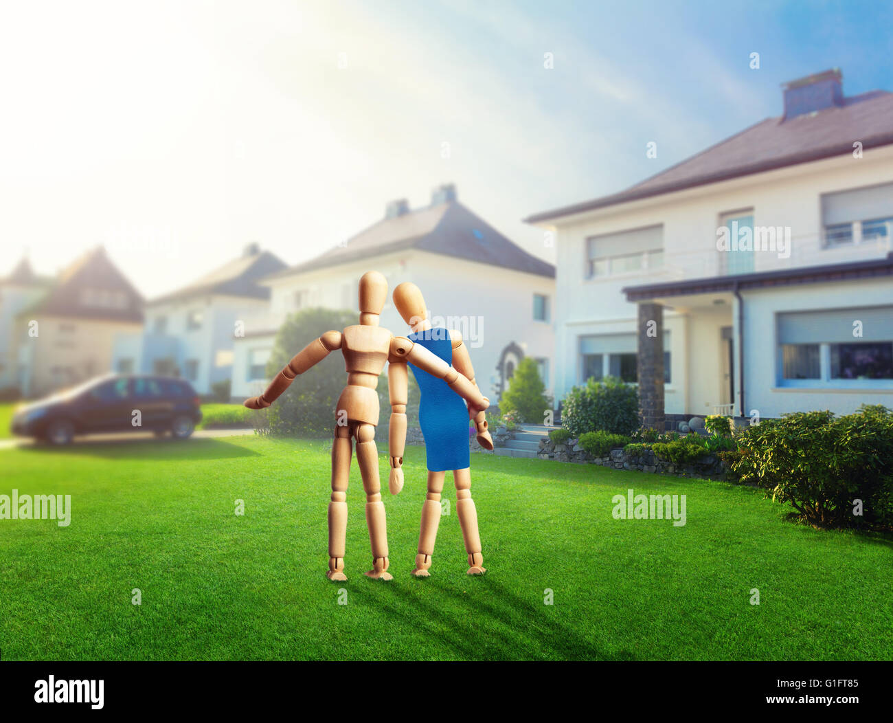 Couple of wooden figures near the house Stock Photo - Alamy