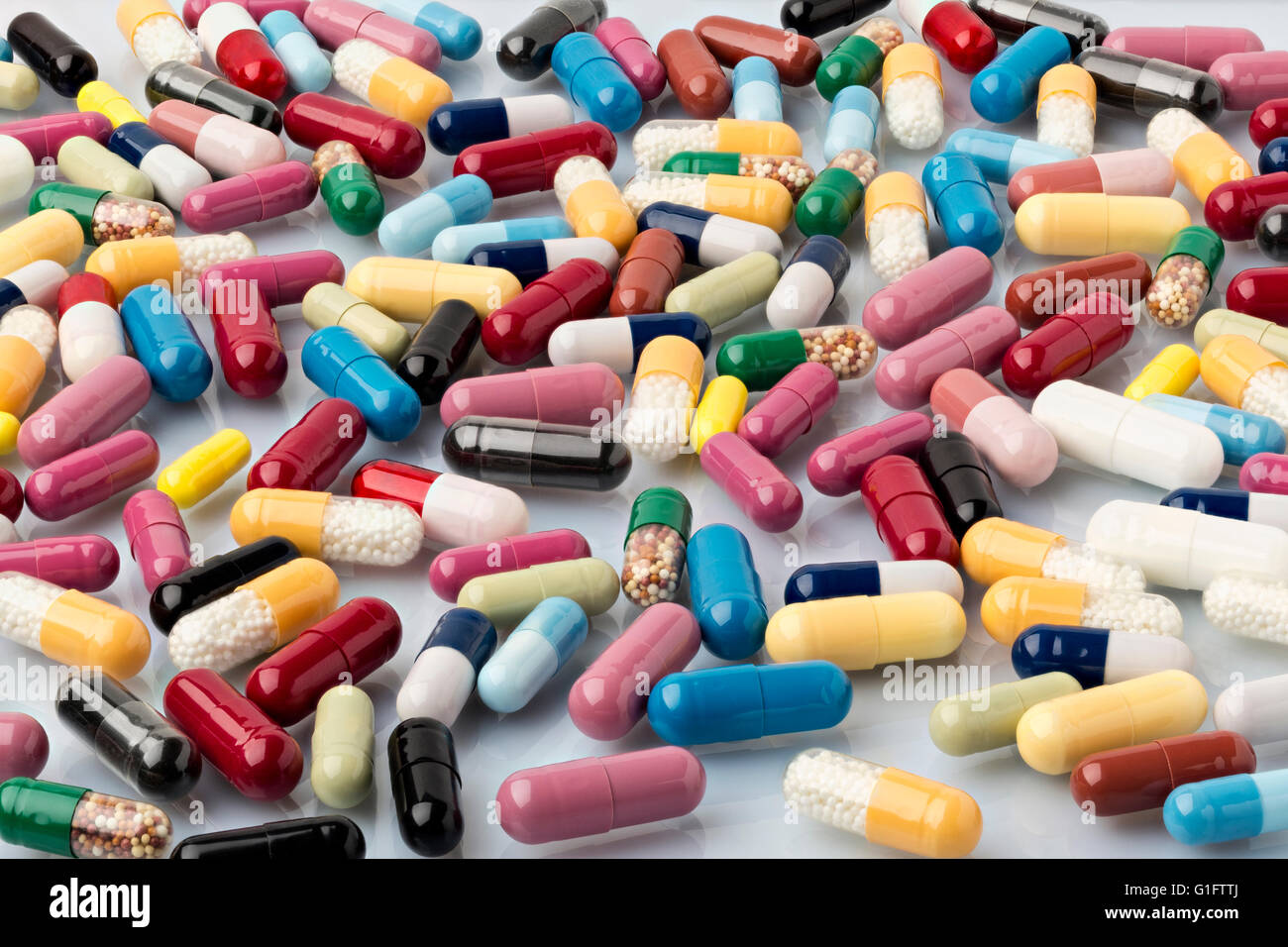 Set of various colorful medical capsules Stock Photo - Alamy