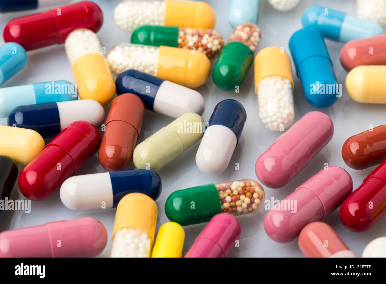 Heap of colorful medical pills and drugs Stock Photo - Alamy