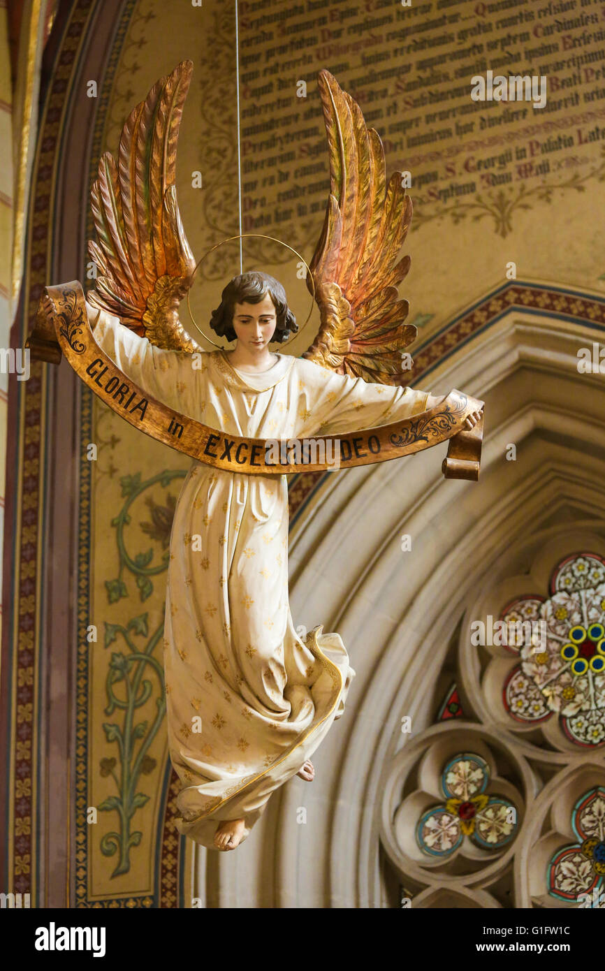 Statue of an angel holding the words Gloria in Excelsis Deo in the ...