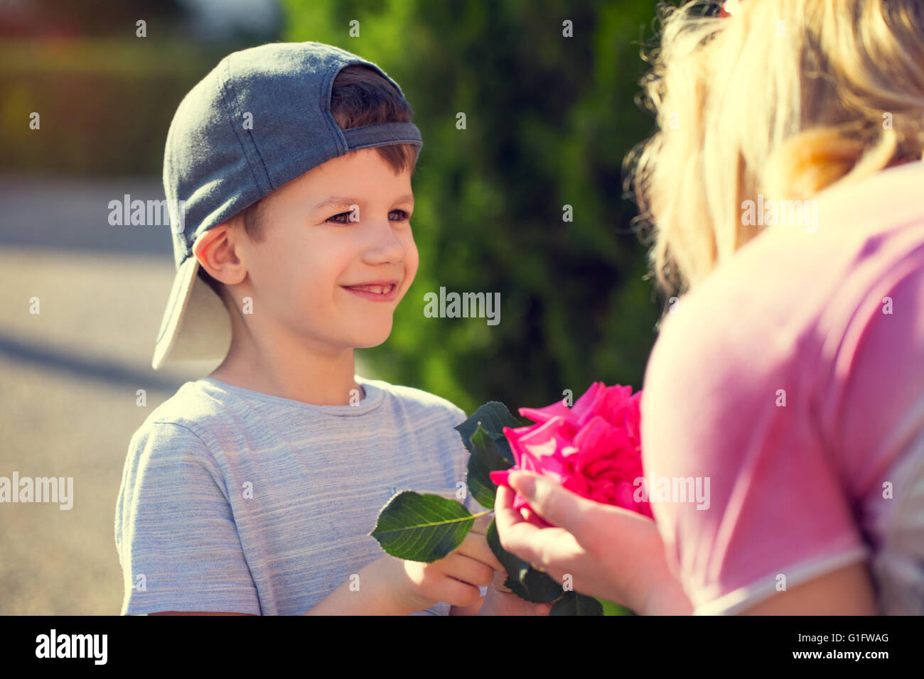 Boy giving flower vintage hi-res stock photography and images - Alamy